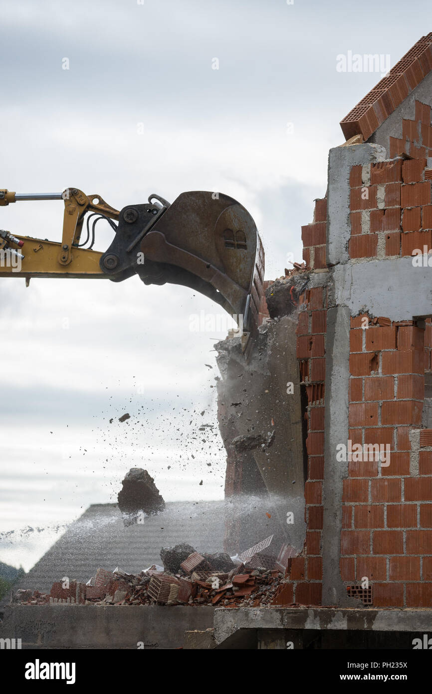 Bucket of a backhoe or mechanical digger against the skyline ...