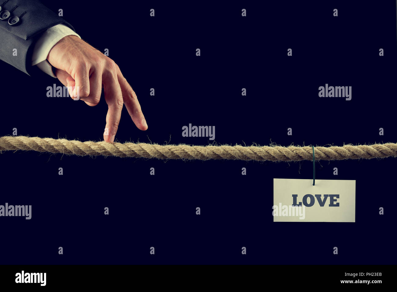 Retro image of a man walking his fingers along a length of rope or a ...