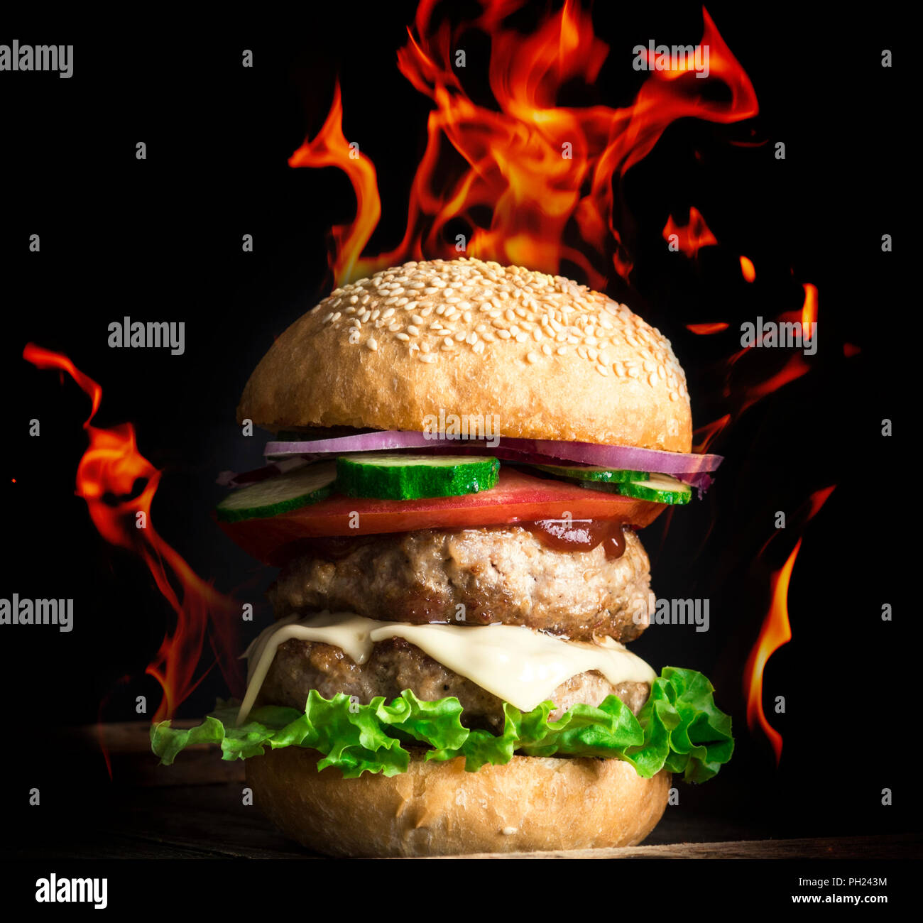 Hamburger fire flame cheeseburger hi-res stock photography and images ...