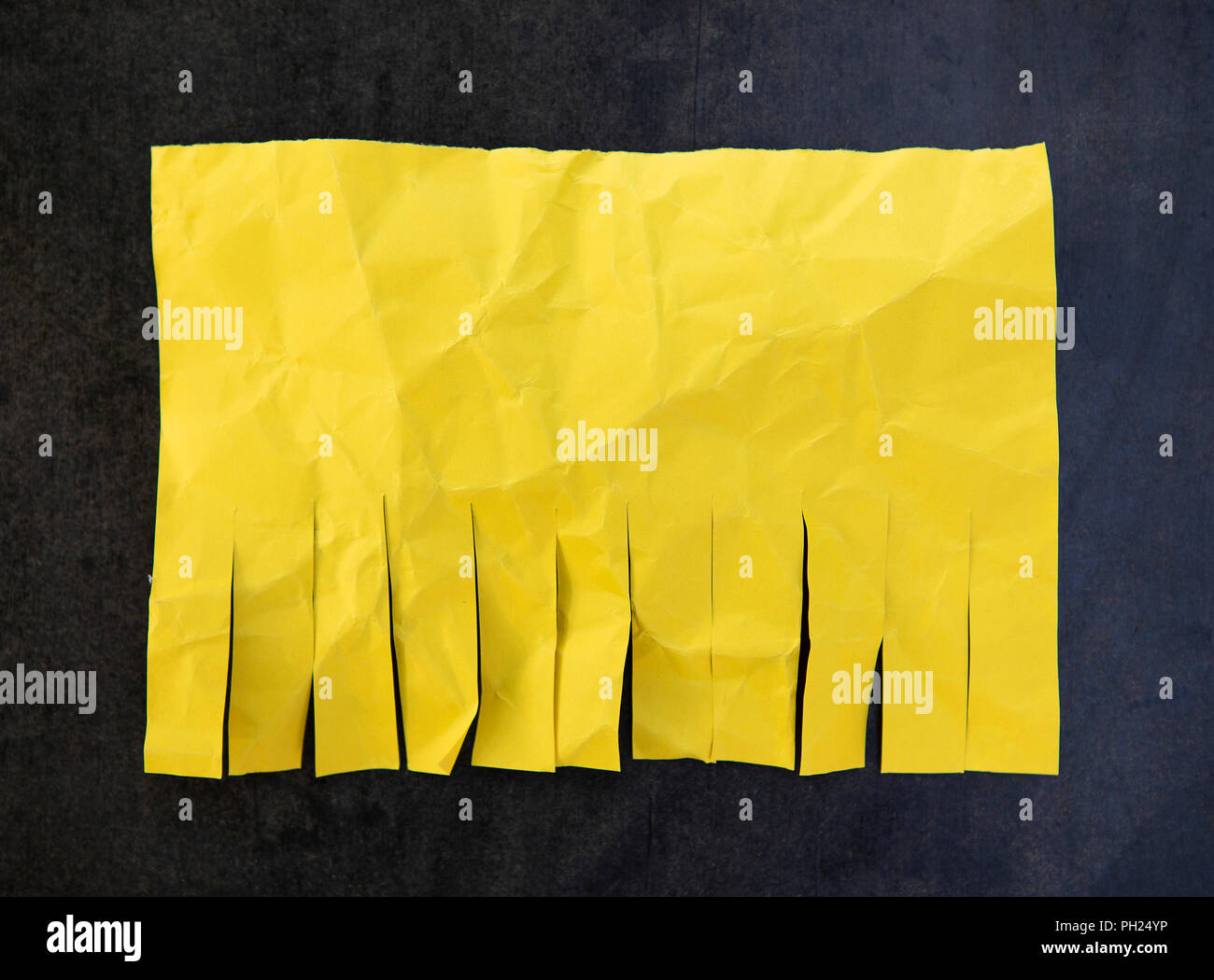 Blank yellow paper with tear off tabs Stock Photo - Alamy