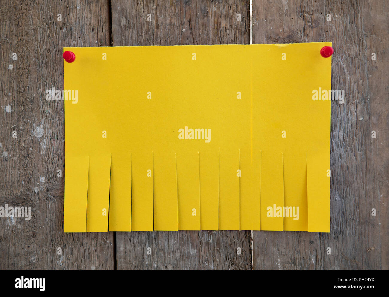 Blank yellow paper with tear off tabs Stock Photo - Alamy