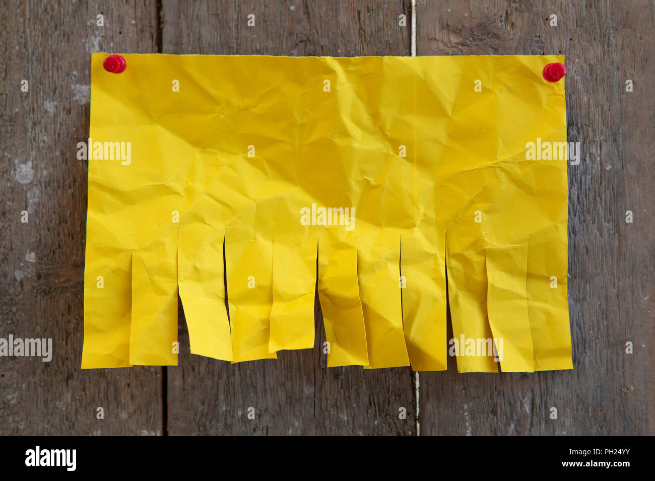 Blank yellow paper with tear off tabs Stock Photo - Alamy