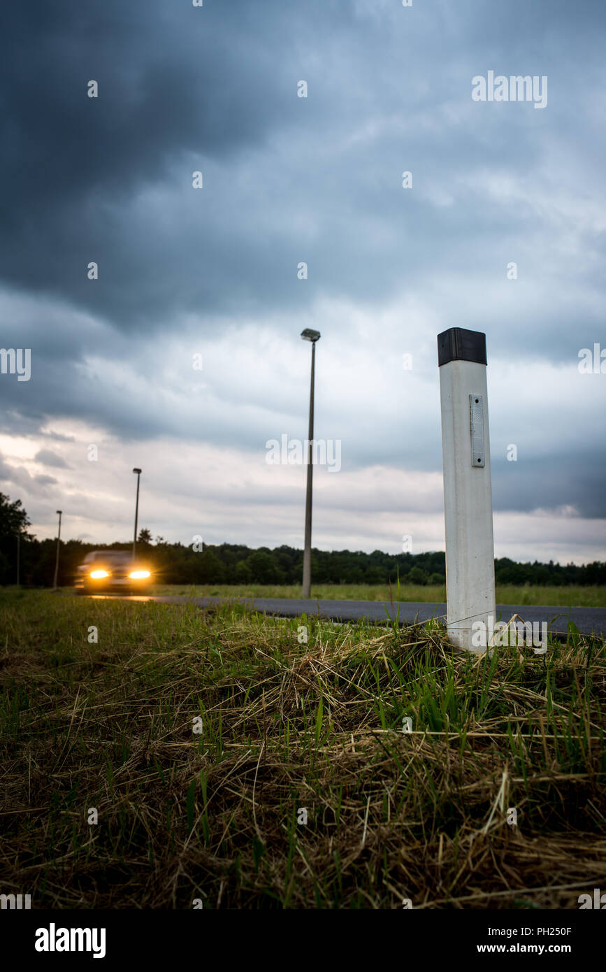 Conceptual image of traffic safety with illuminated pole on roadside ...