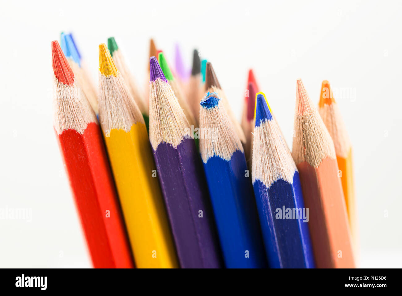 Group of colorful pencil crayons in the colours of the spectrum with ...