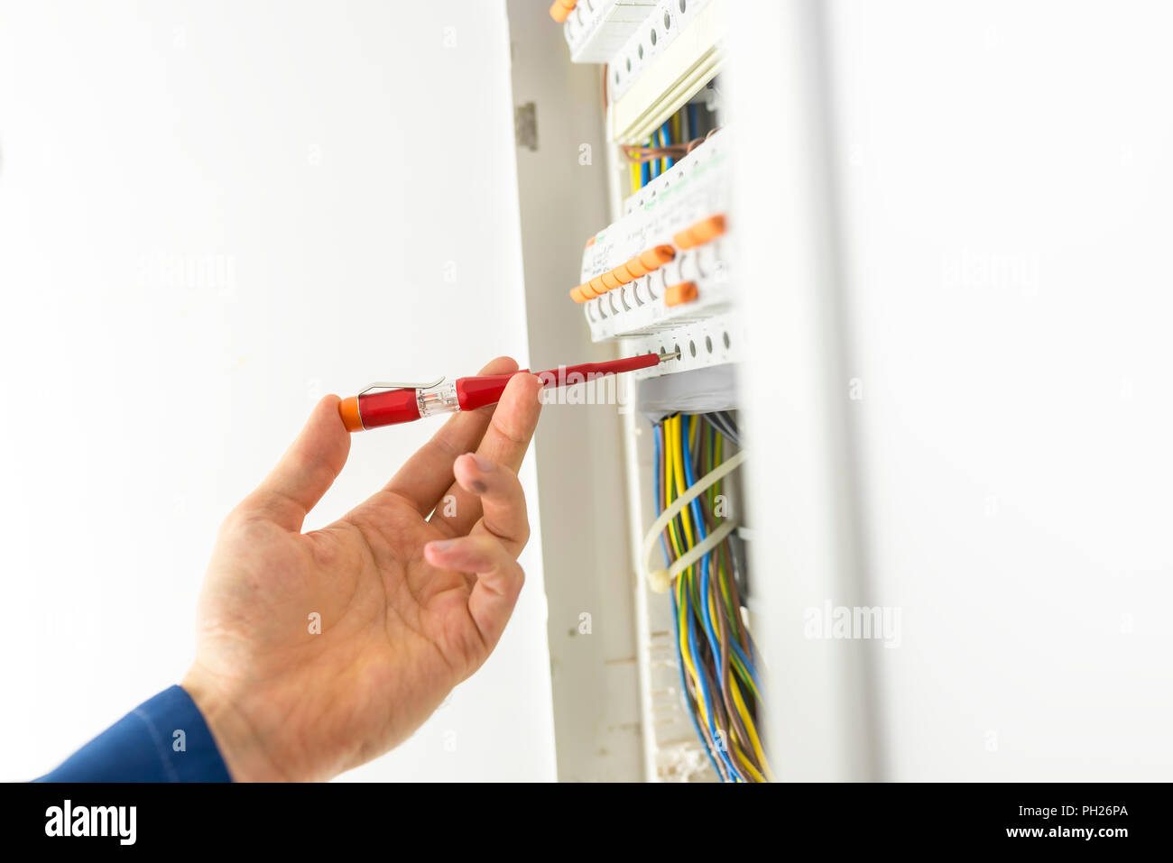 Repairman testing circuit board checking hi-res stock photography and ...