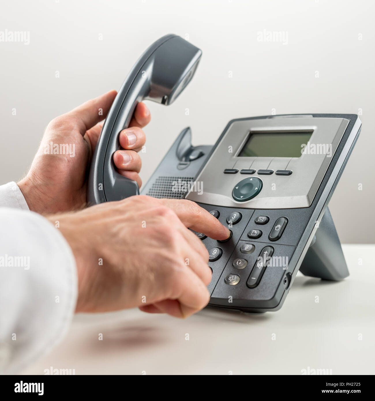 Hand picking up phone hi-res stock photography and images - Alamy