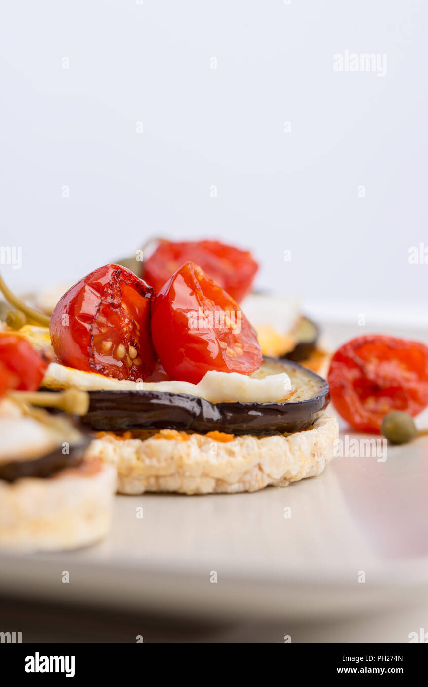 Delicious Italian appetizer of corn cracker topped with baked egg and ...