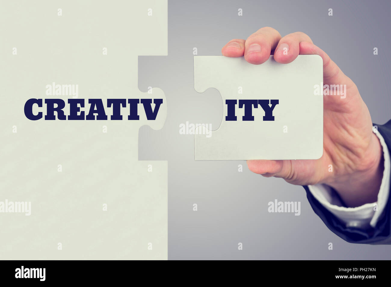 Conceptual image of Creativity with the word split over two matching ...