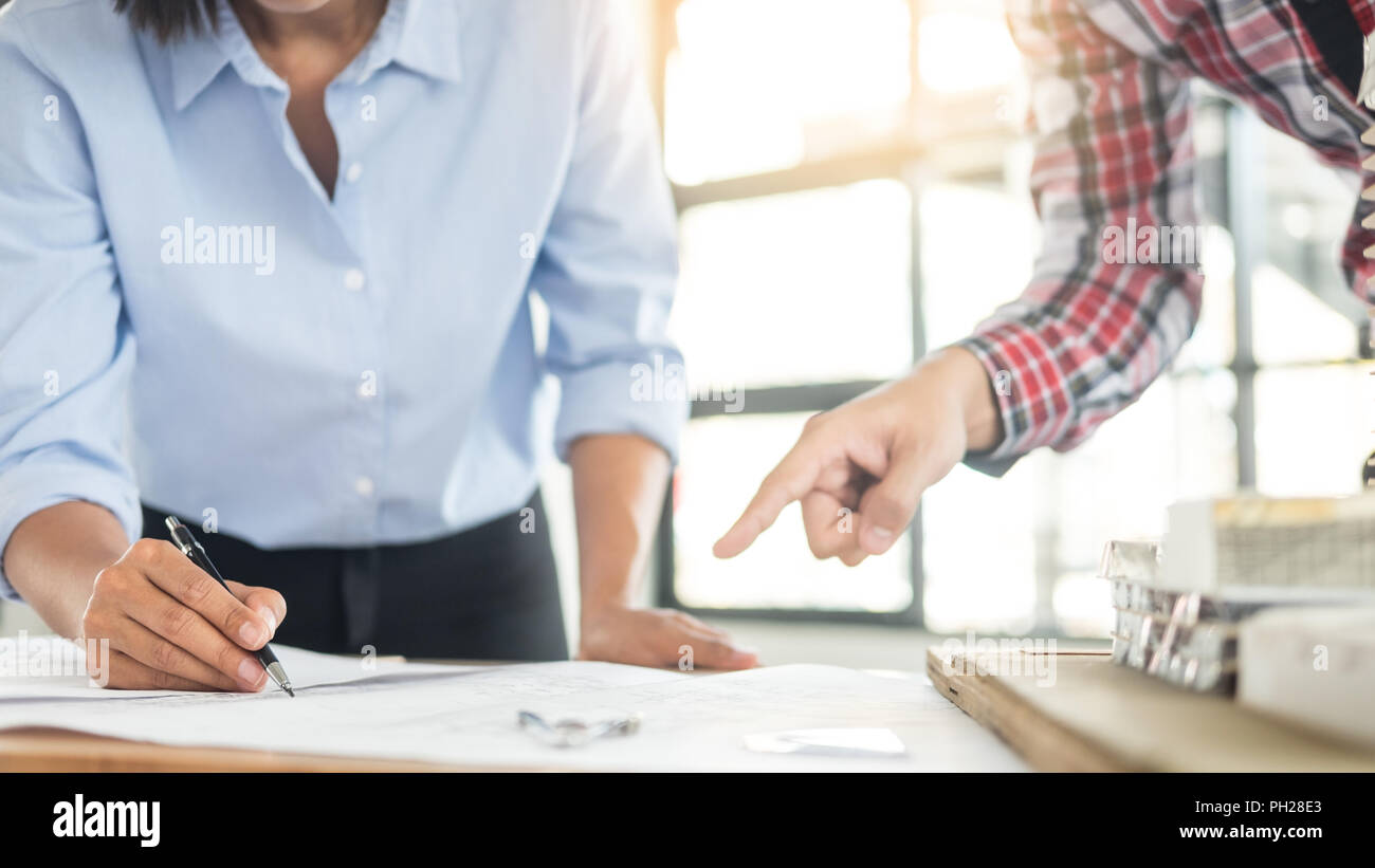 Close-up Of Person's engineer Hand Drawing Plan On Blue Print with ...