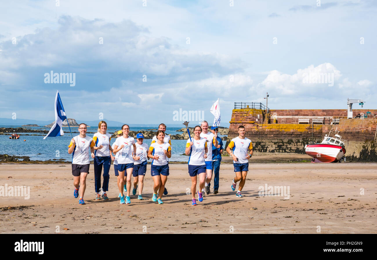 Runners carrying flag hi-res stock photography and images - Alamy
