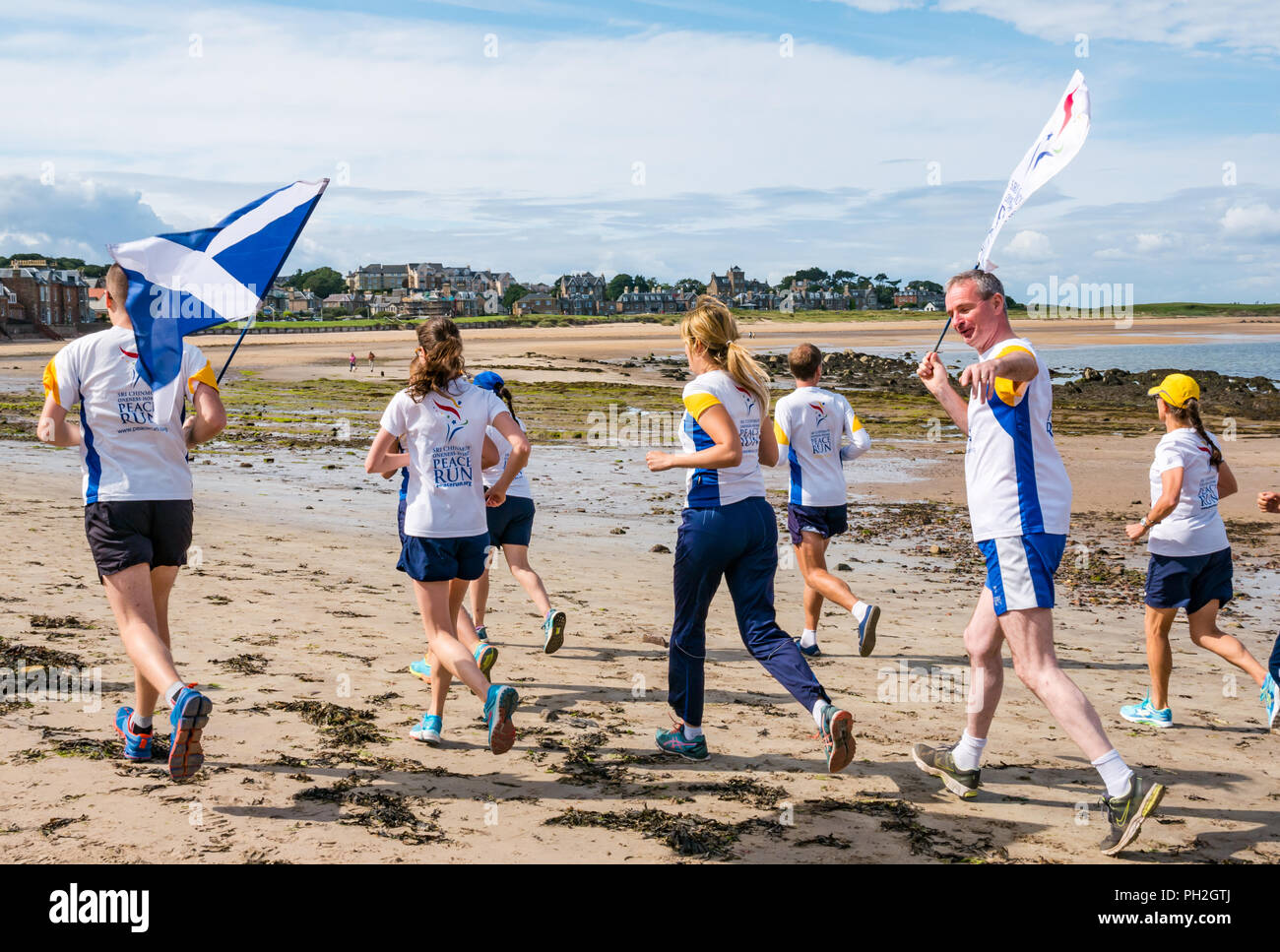 Runners carrying flag hi-res stock photography and images - Alamy