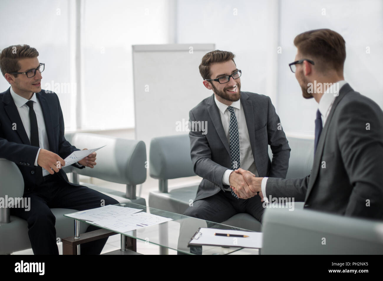 business partners talking at the office Desk Stock Photo - Alamy
