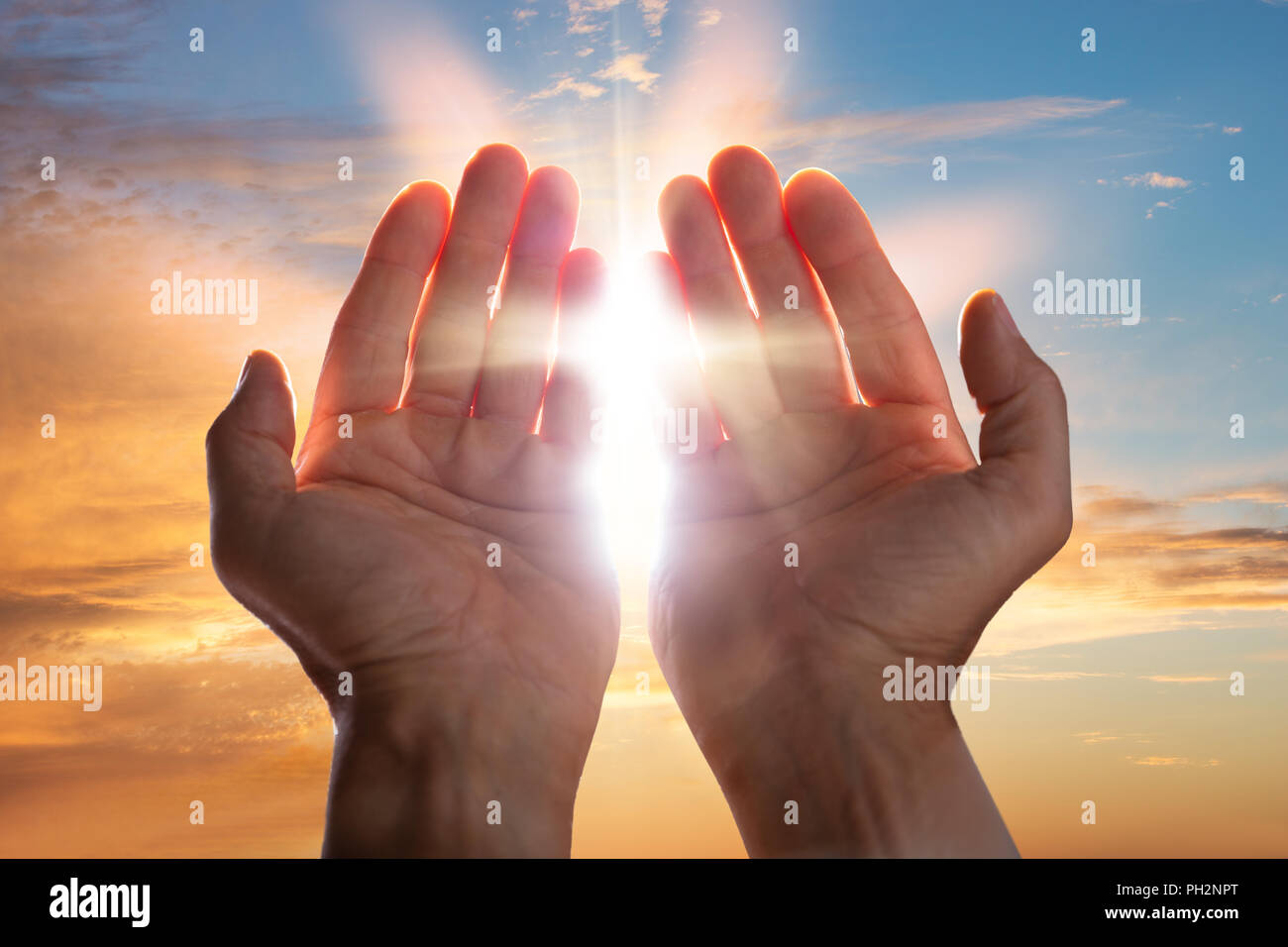 Close-up Of A Praying Hands With Sunlight Stock Photo - Alamy