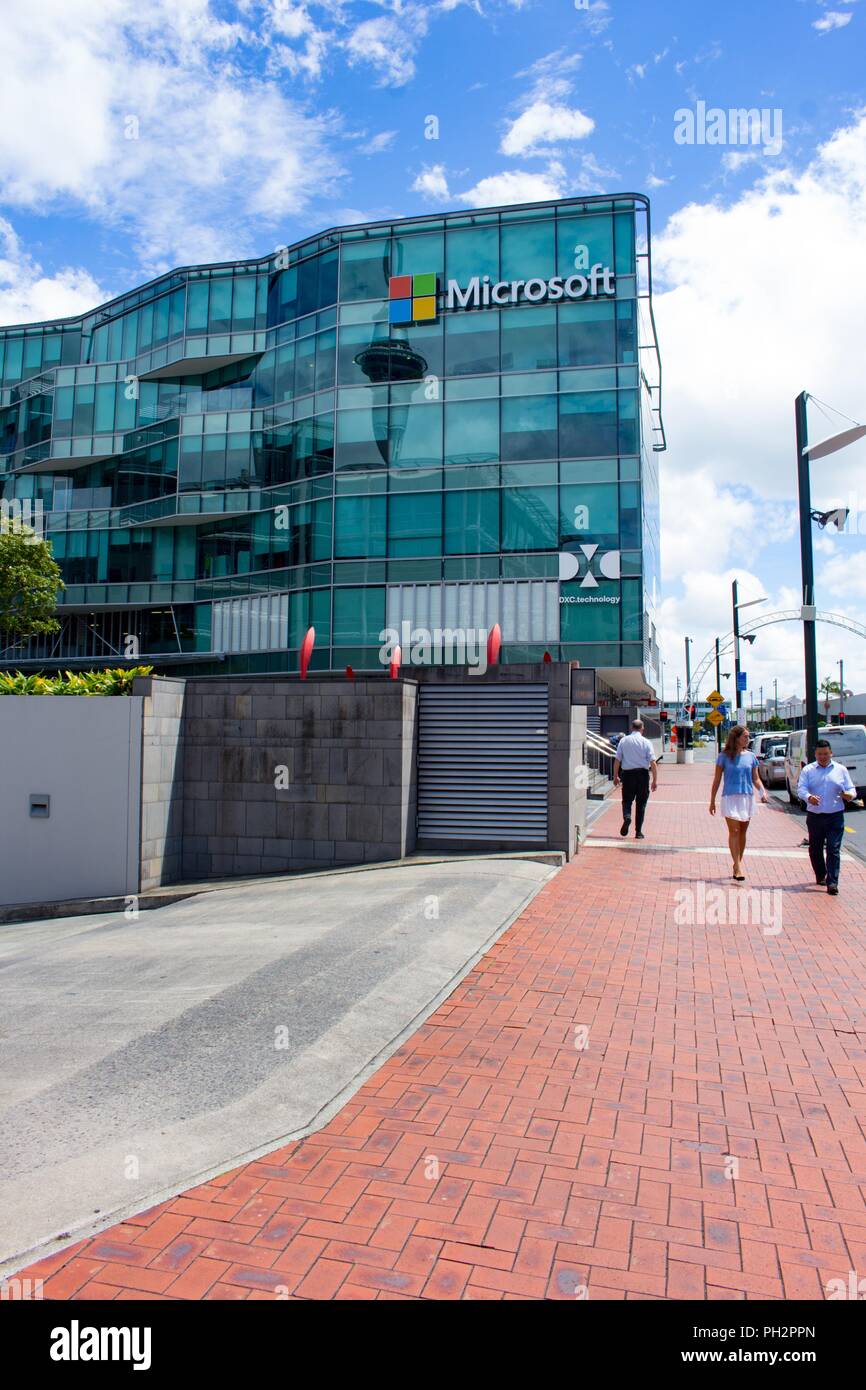 People walk past the facade of the regional headquarters of Microsoft ...