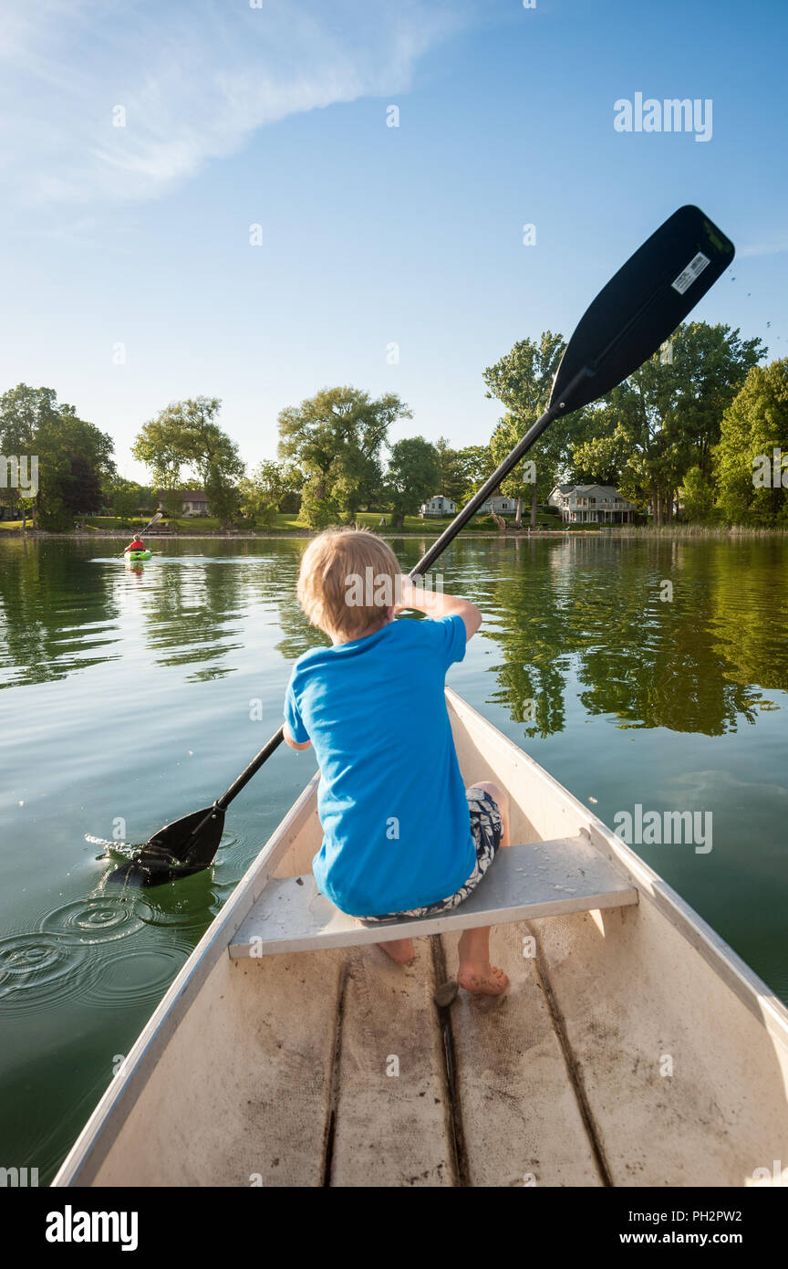 Little boy canoeing, Lake Ontario, PEC, Canada Stock Photo - Alamy