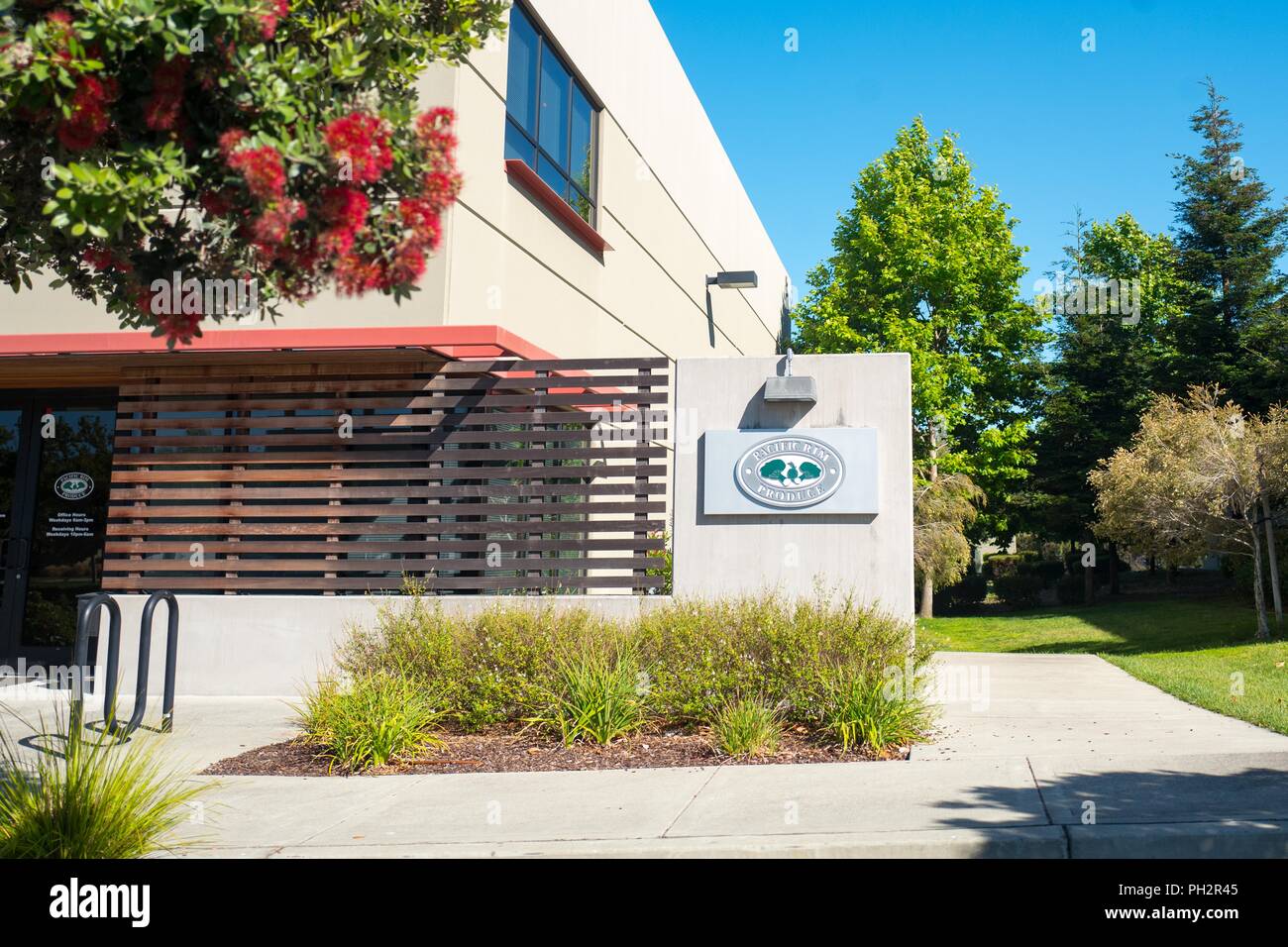 Sign with logo on facade at headquarters of Asian produce importer ...