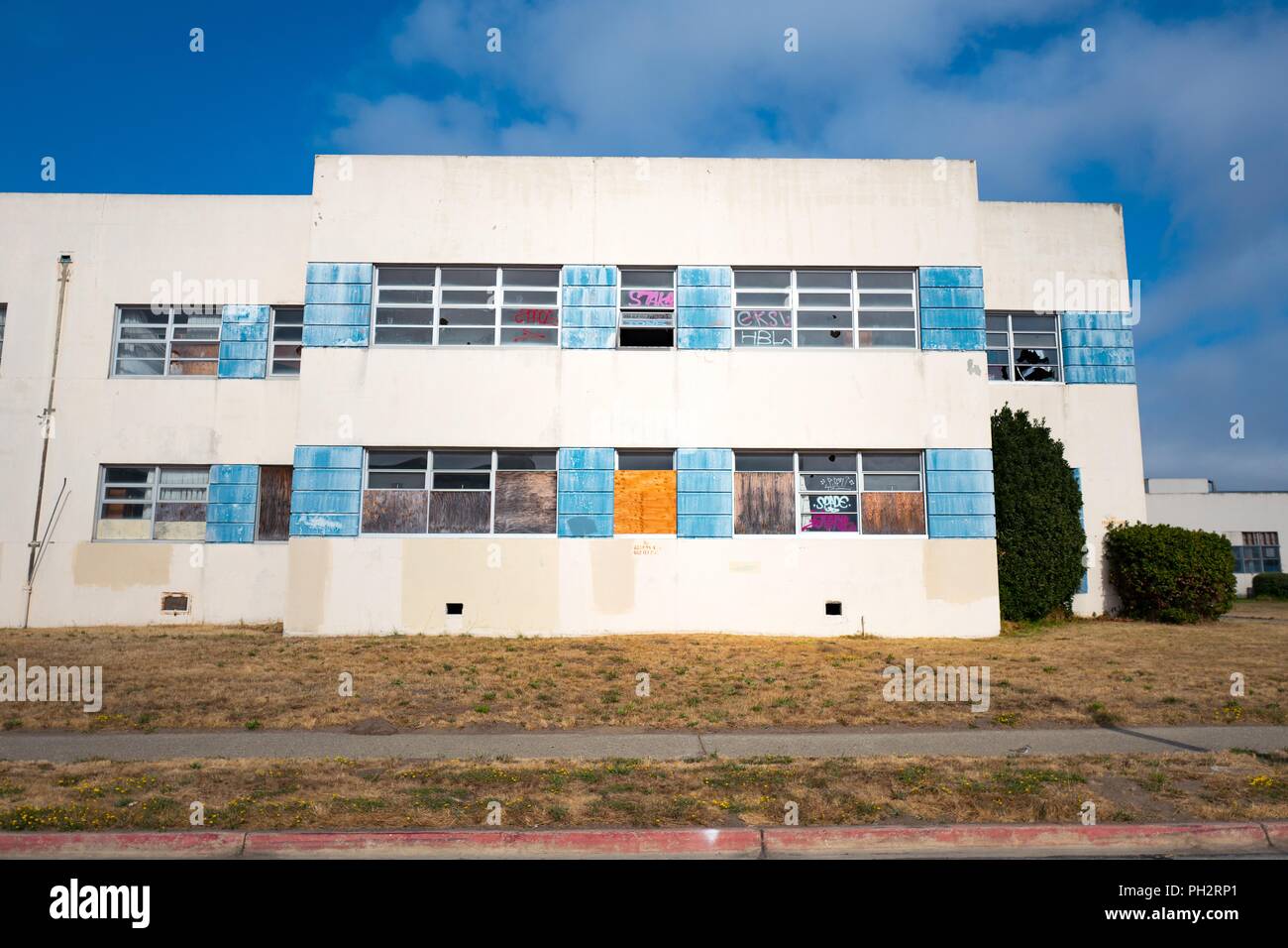Former barracks building with graffiti and boarded up windows at the ...