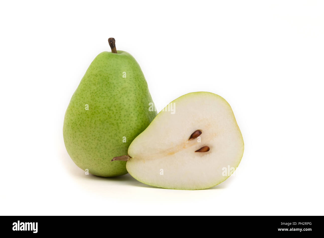 Green pear and half on isolated white background closeup Stock Photo ...