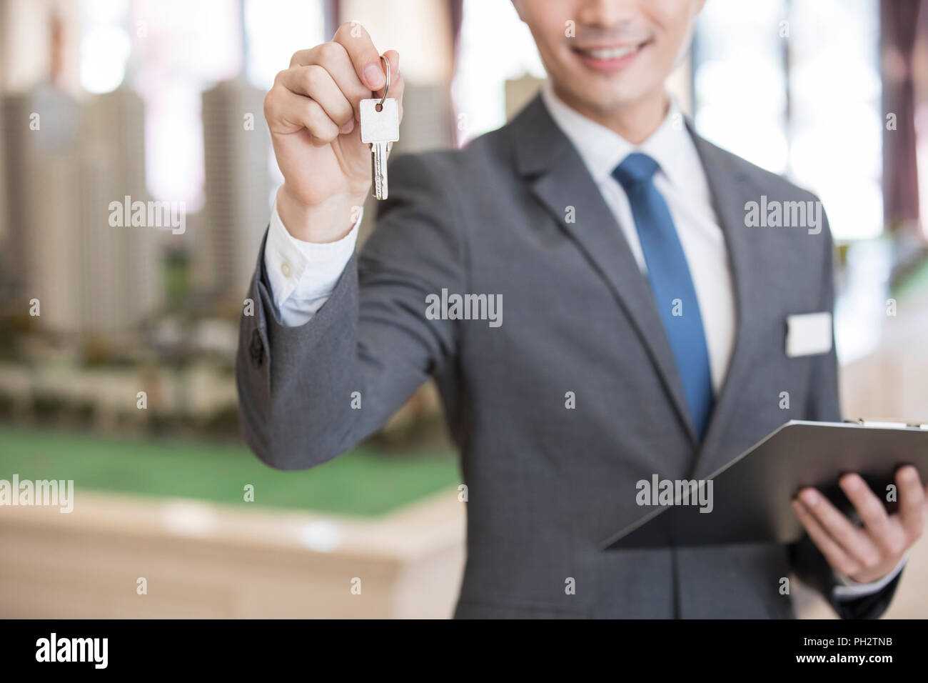 Indian business man house key hi-res stock photography and images - Alamy