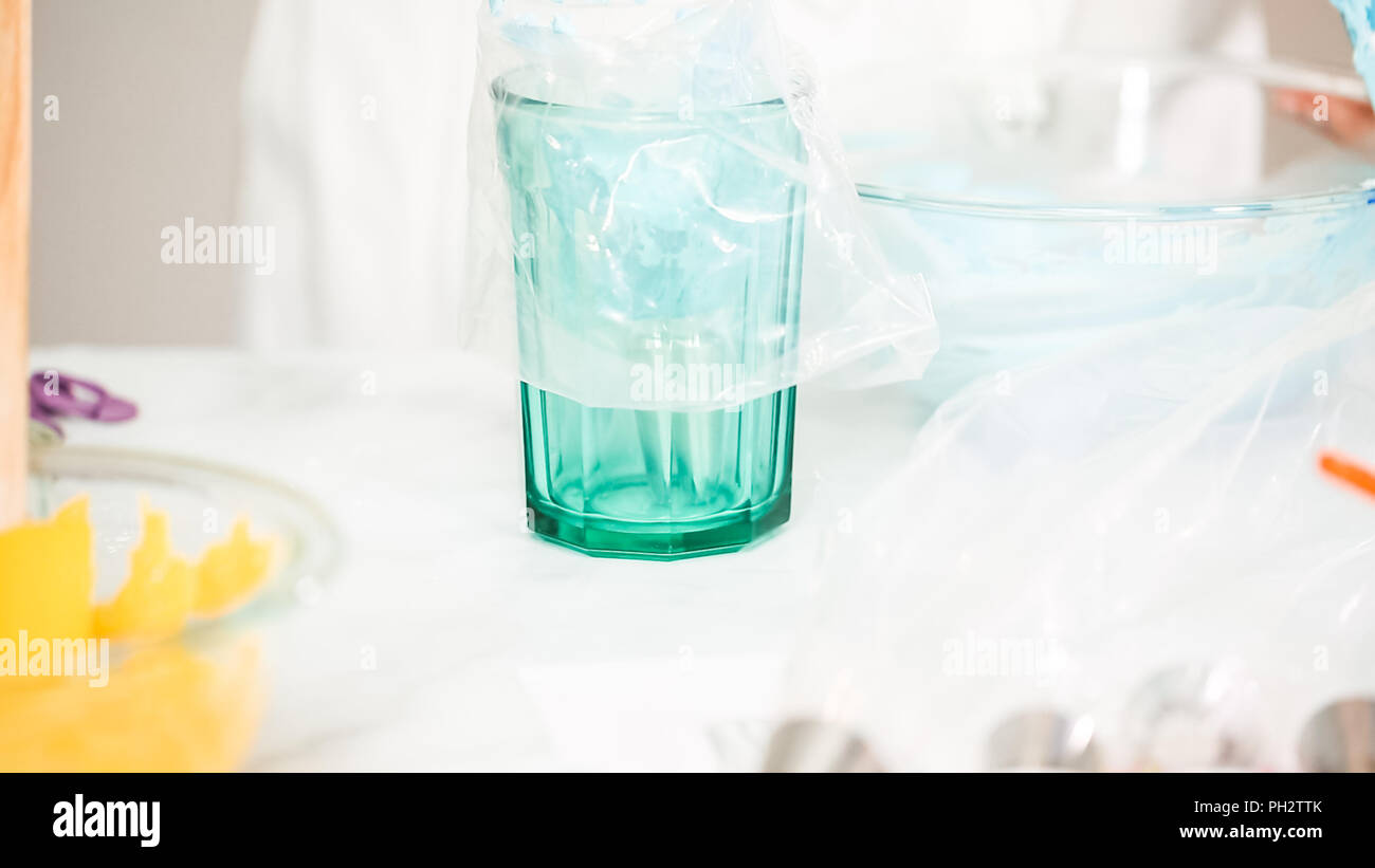 Step by step. Preparing piping bags with colorful buttercream frosting ...