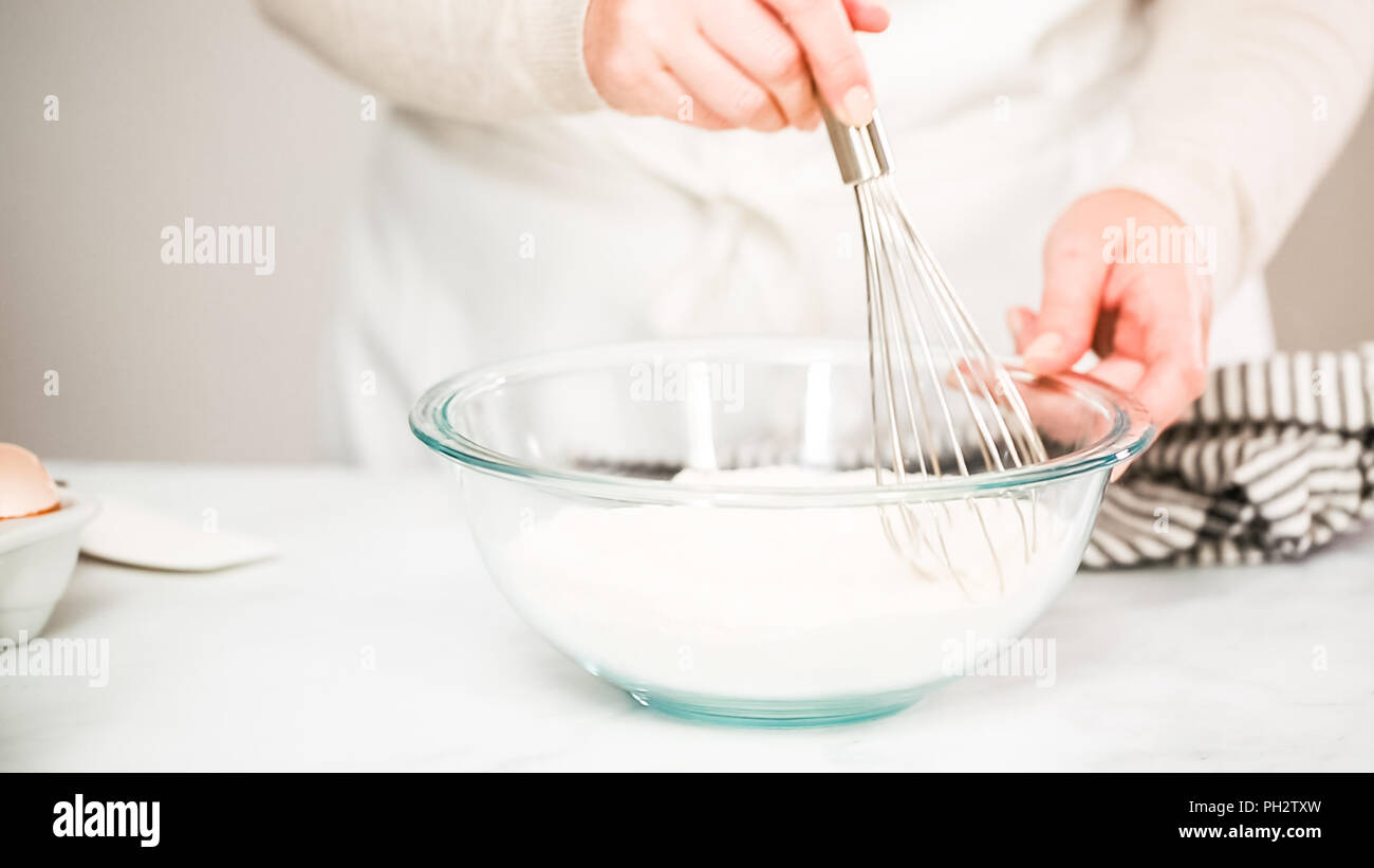Step by step. Mixing ingredients for vanilla cupcakes Stock Photo - Alamy