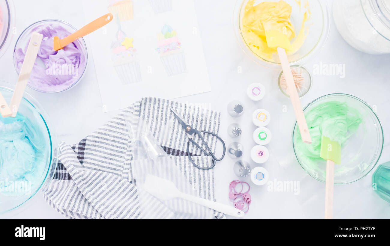 Step by step. Preparing piping bags with colorful buttercream frosting ...