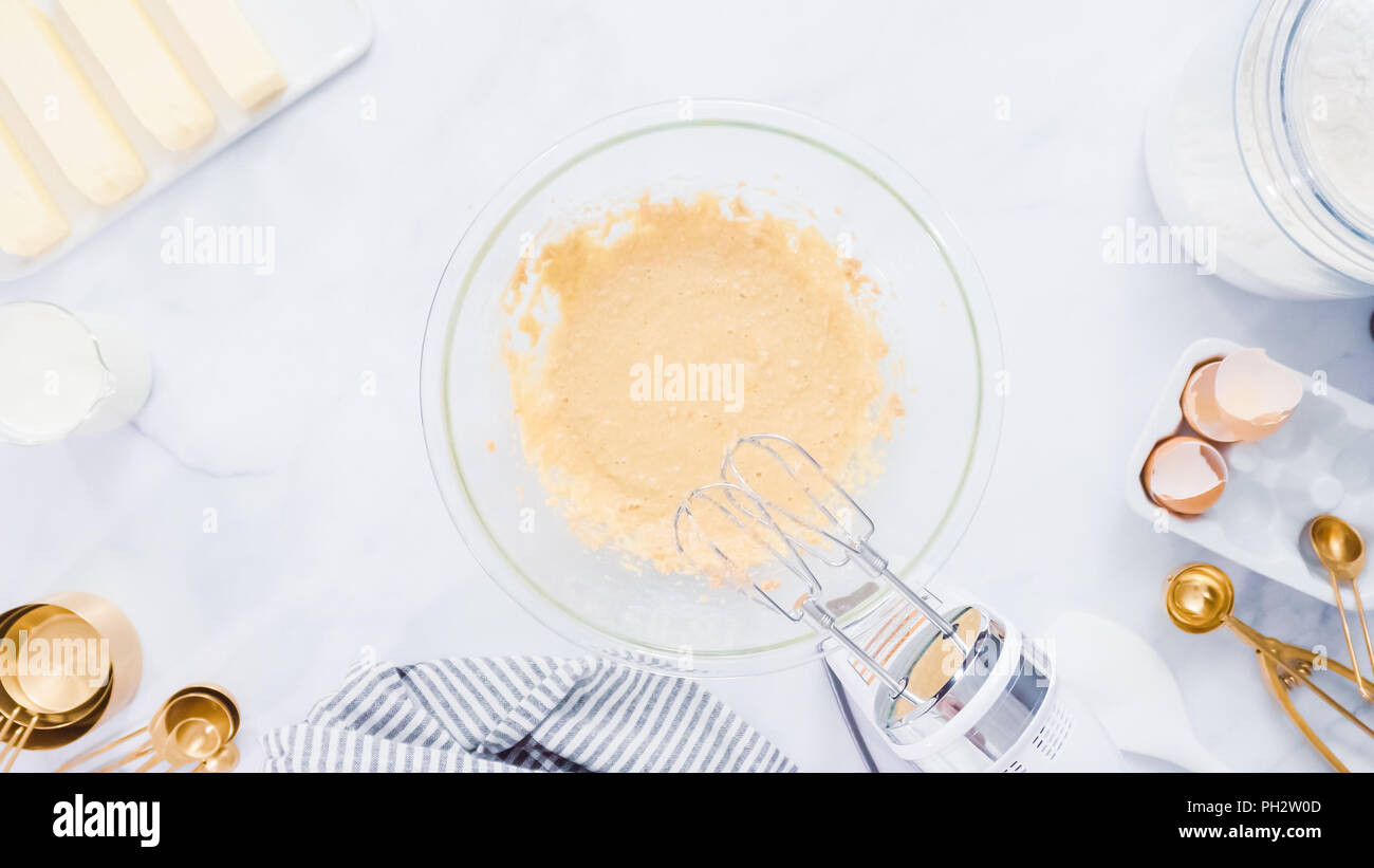 Step by step. Mixing ingredients for vanilla cupcakes Stock Photo - Alamy