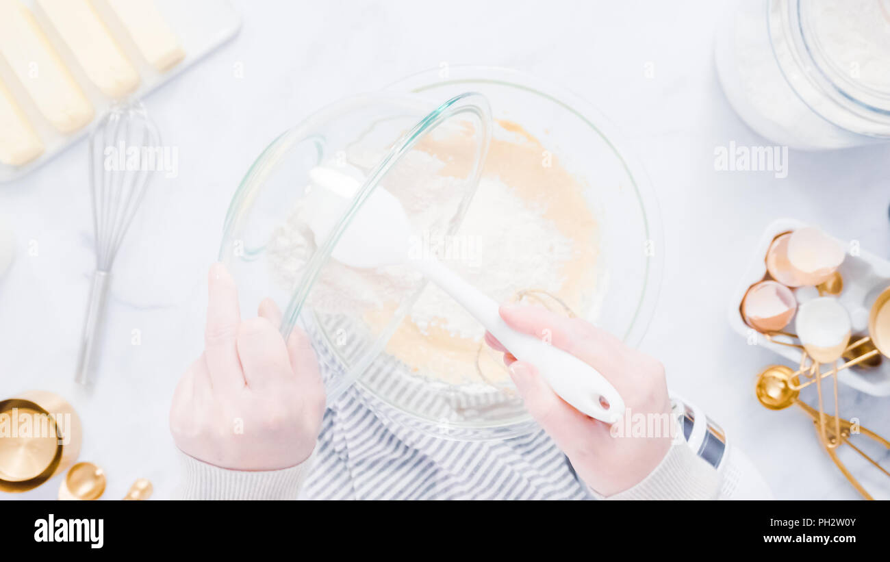 Step by step. Mixing ingredients for vanilla cupcakes Stock Photo - Alamy