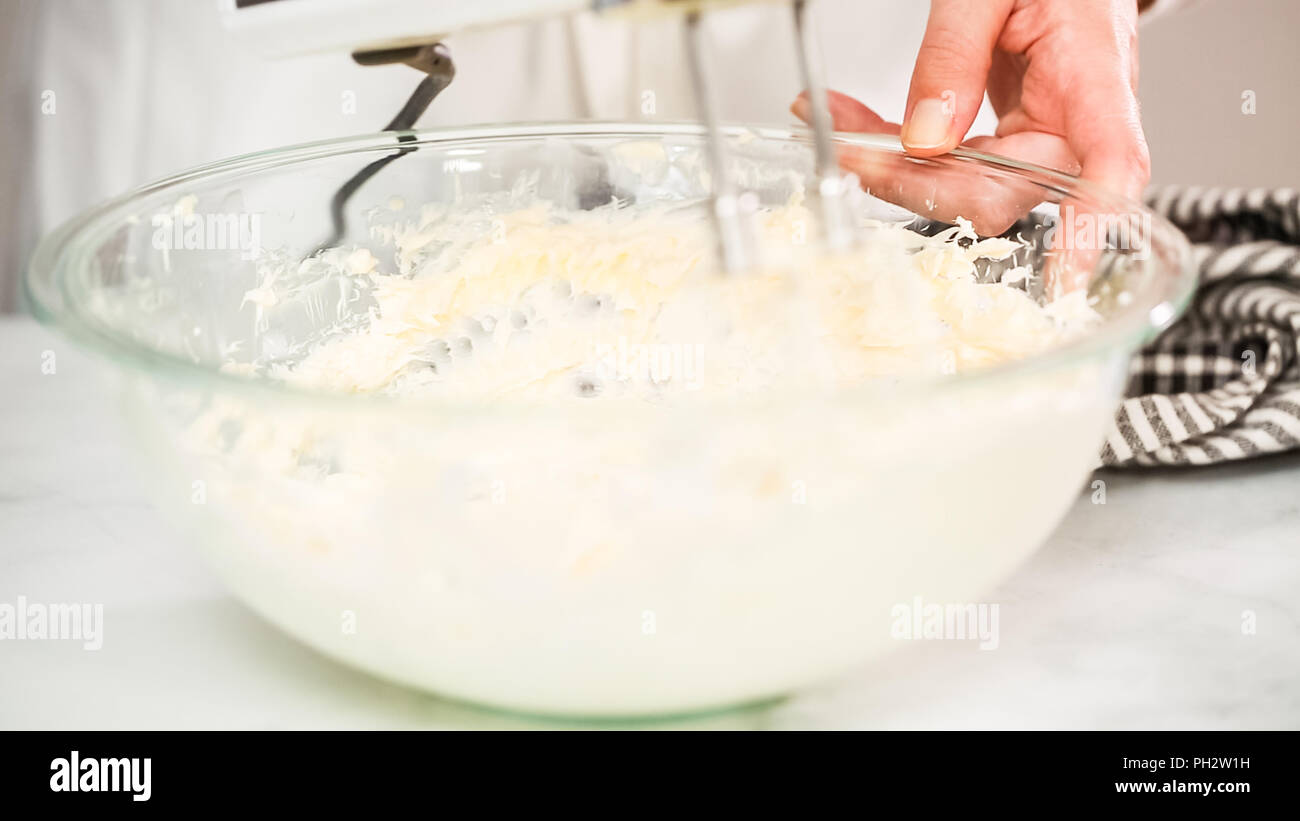 Step by step. Mixing buttercream frosting for vanilla cupcakes Stock ...