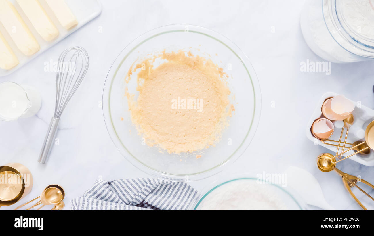 Step by step. Mixing ingredients for vanilla cupcakes Stock Photo - Alamy