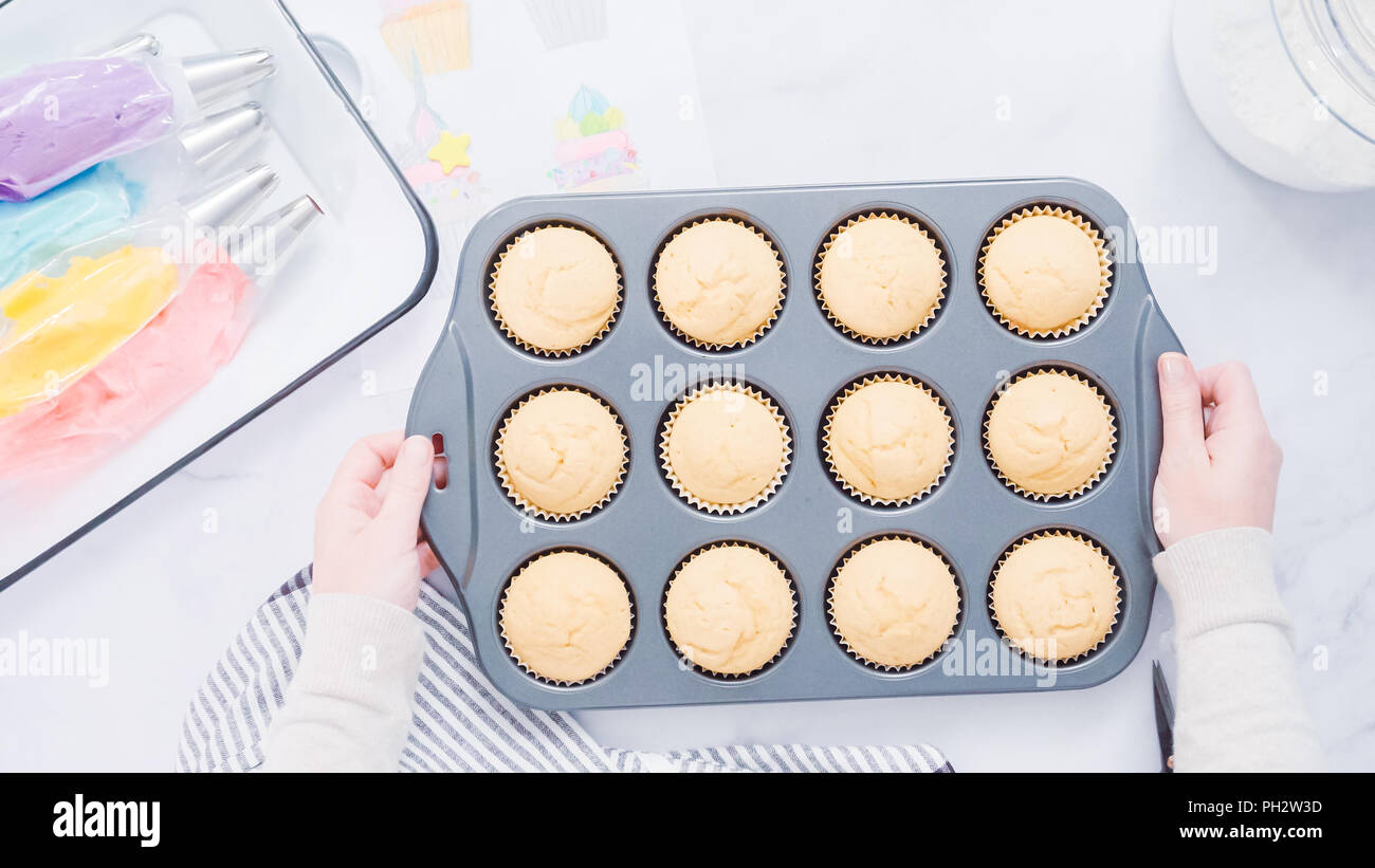 Step by step. Freshly bakes vanilla cupcakes Stock Photo - Alamy