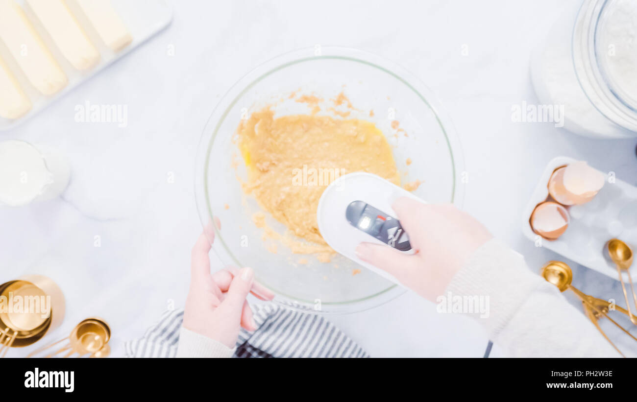 Step by step. Mixing ingredients for vanilla cupcakes Stock Photo - Alamy