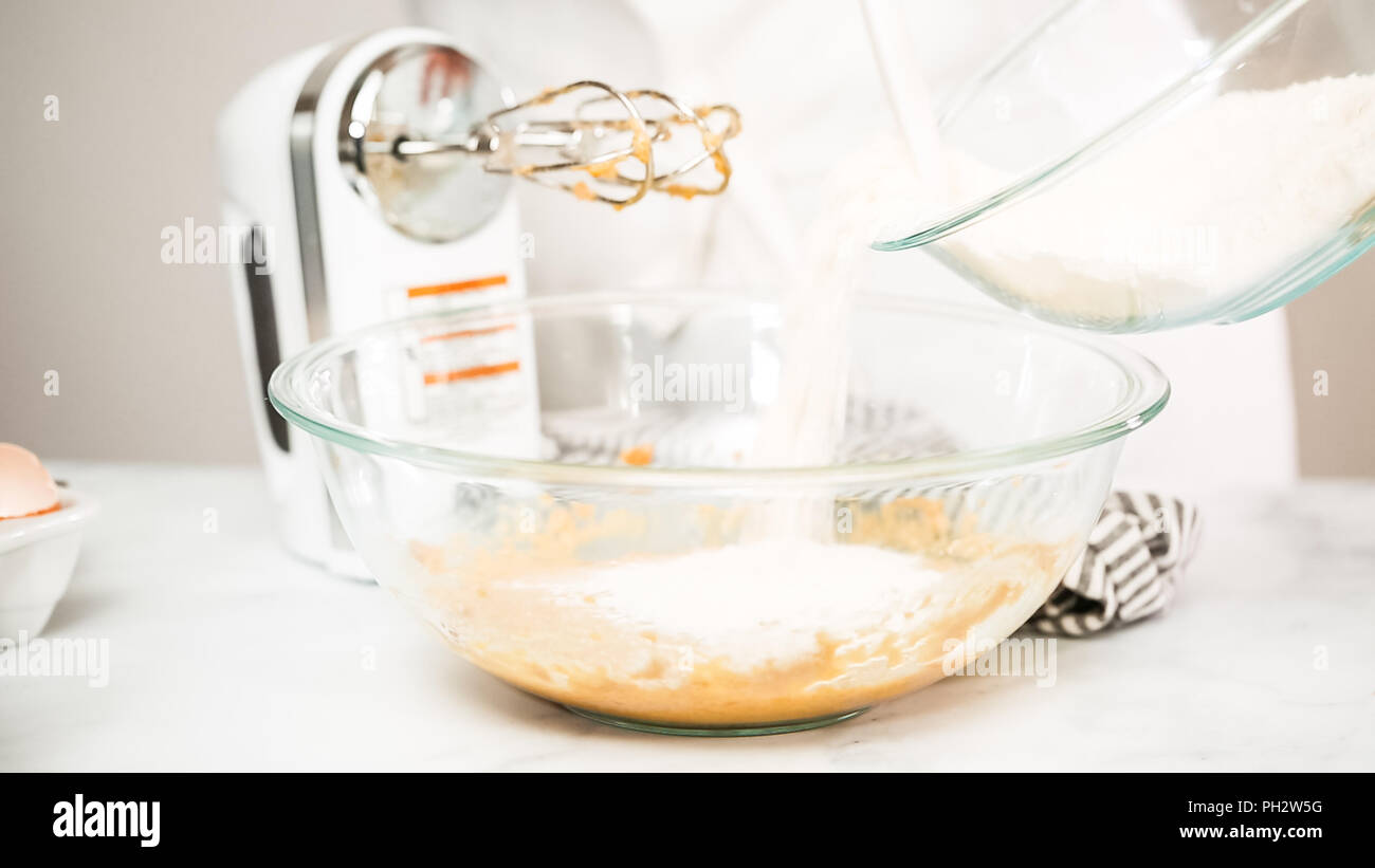Step by step. Mixing ingredients for vanilla cupcakes Stock Photo - Alamy