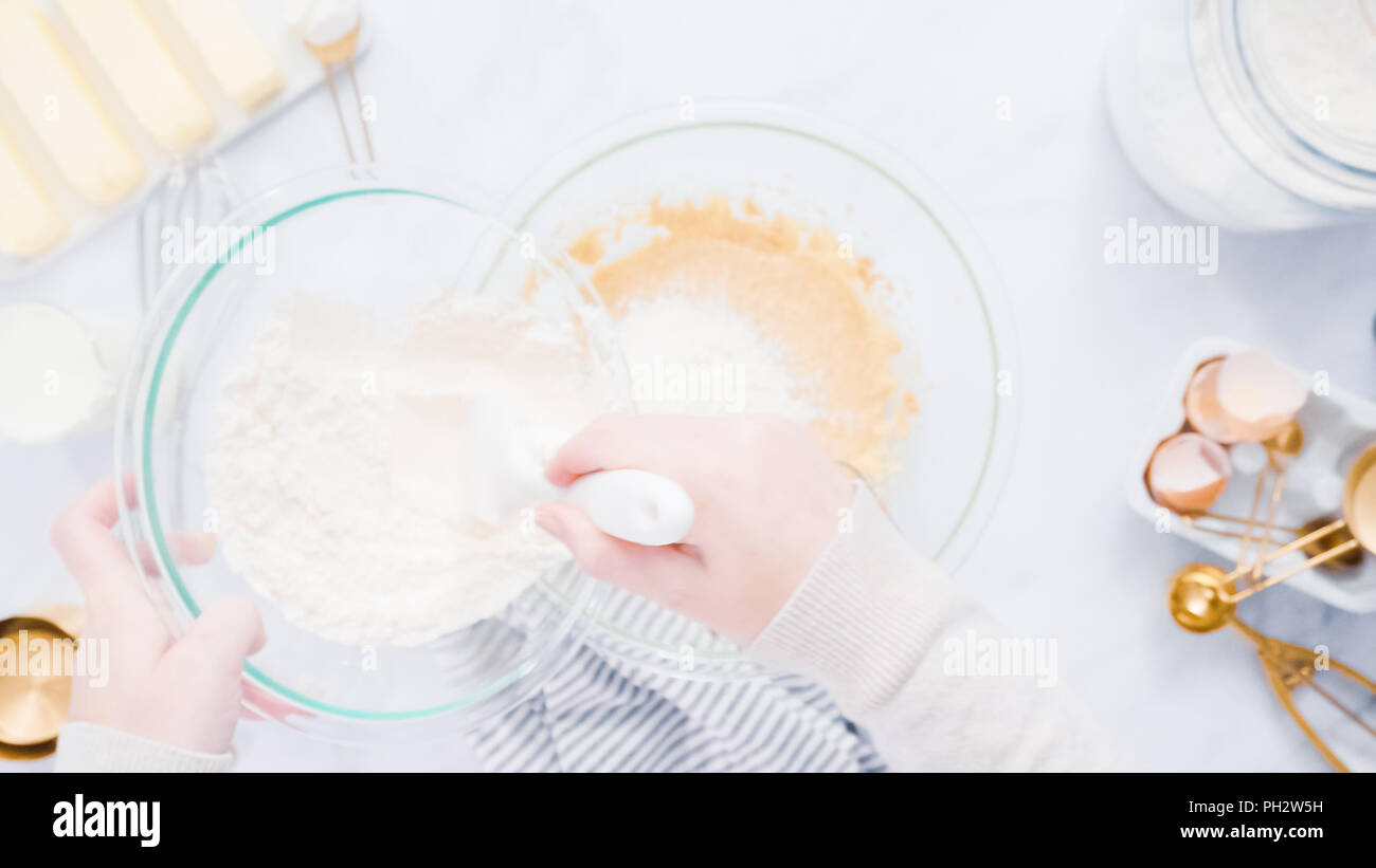 Step by step. Mixing ingredients for vanilla cupcakes Stock Photo - Alamy