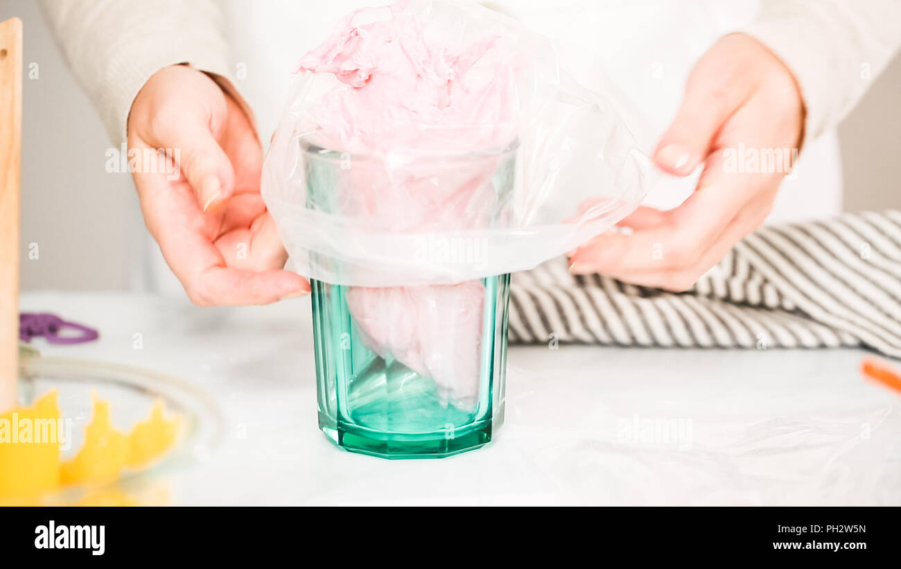 Step by step. Preparing piping bags with colorful buttercream frosting ...