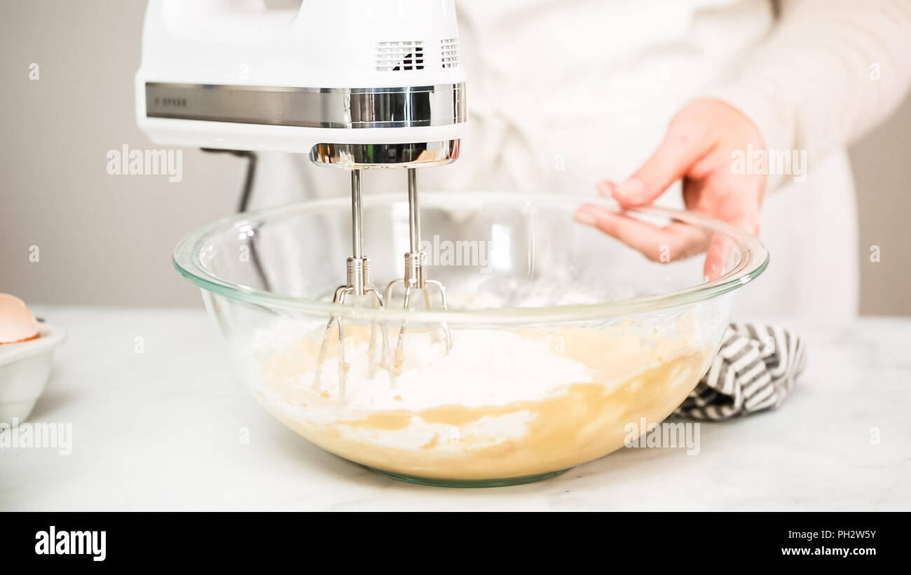 Step by step. Mixing ingredients for vanilla cupcakes Stock Photo - Alamy