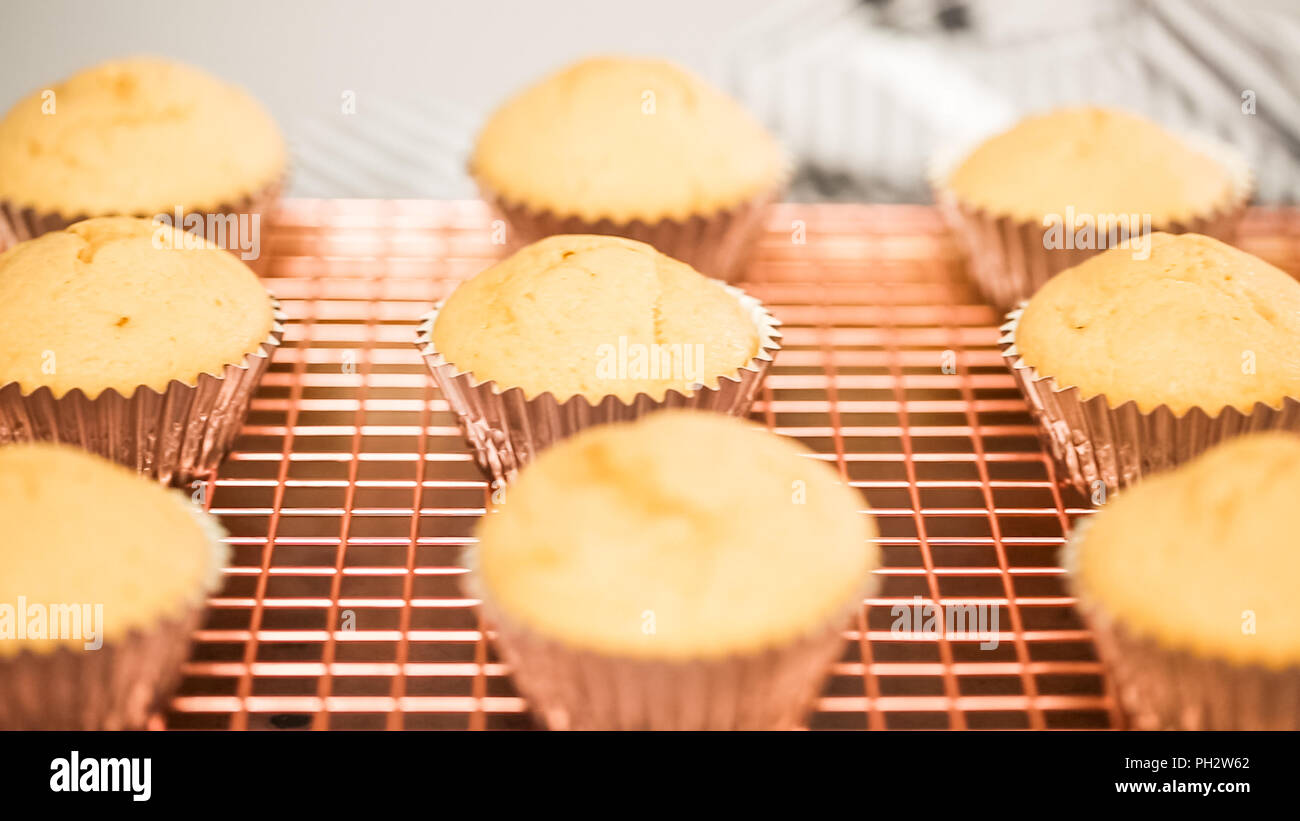 Step by step. Freshly bakes vanilla cupcakes Stock Photo - Alamy