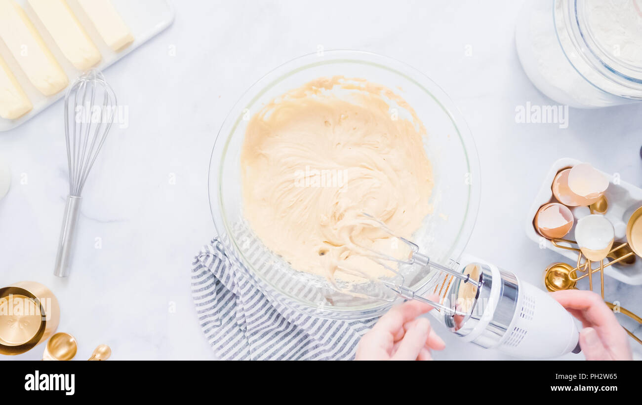 Step by step. Mixing ingredients for vanilla cupcakes Stock Photo - Alamy