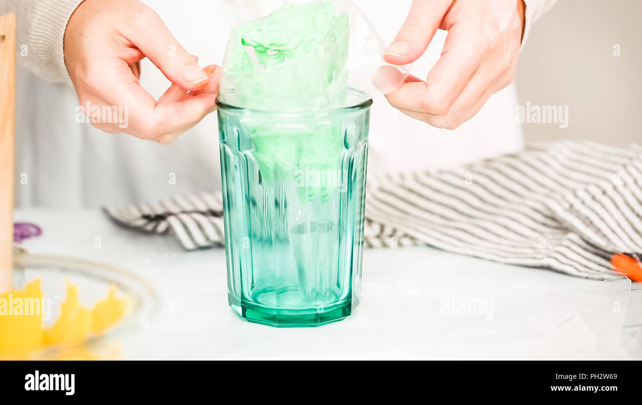 Step by step. Preparing piping bags with colorful buttercream frosting ...