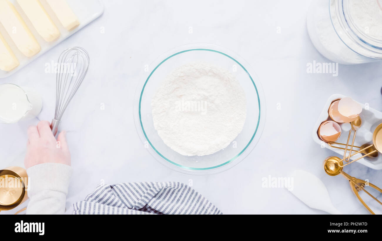 Step by step. Mixing ingredients for vanilla cupcakes Stock Photo - Alamy
