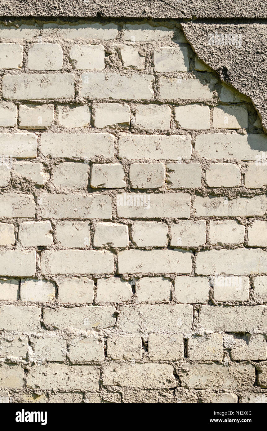 Scratched white brick wall. Abstract background. Outdoors. Vertical ...