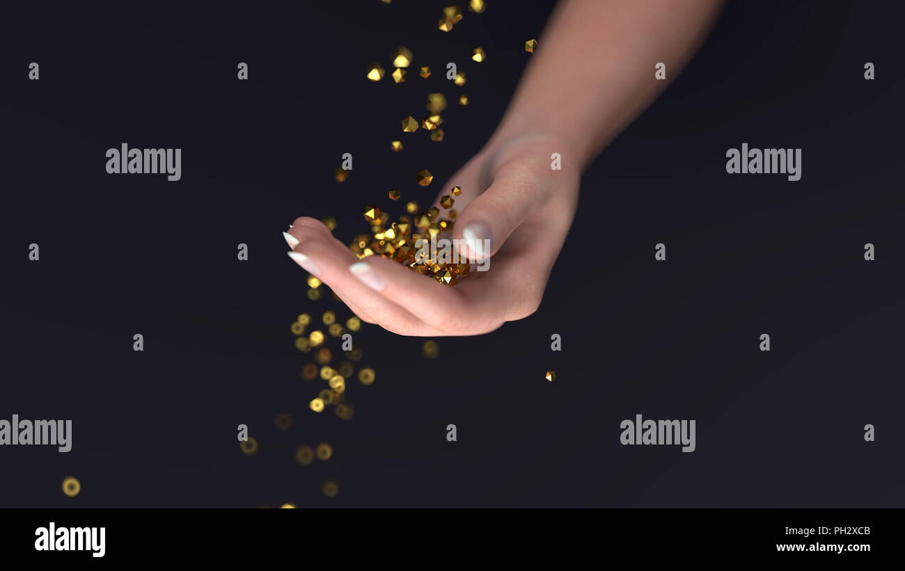 golden crystals fall into the hand Stock Photo - Alamy