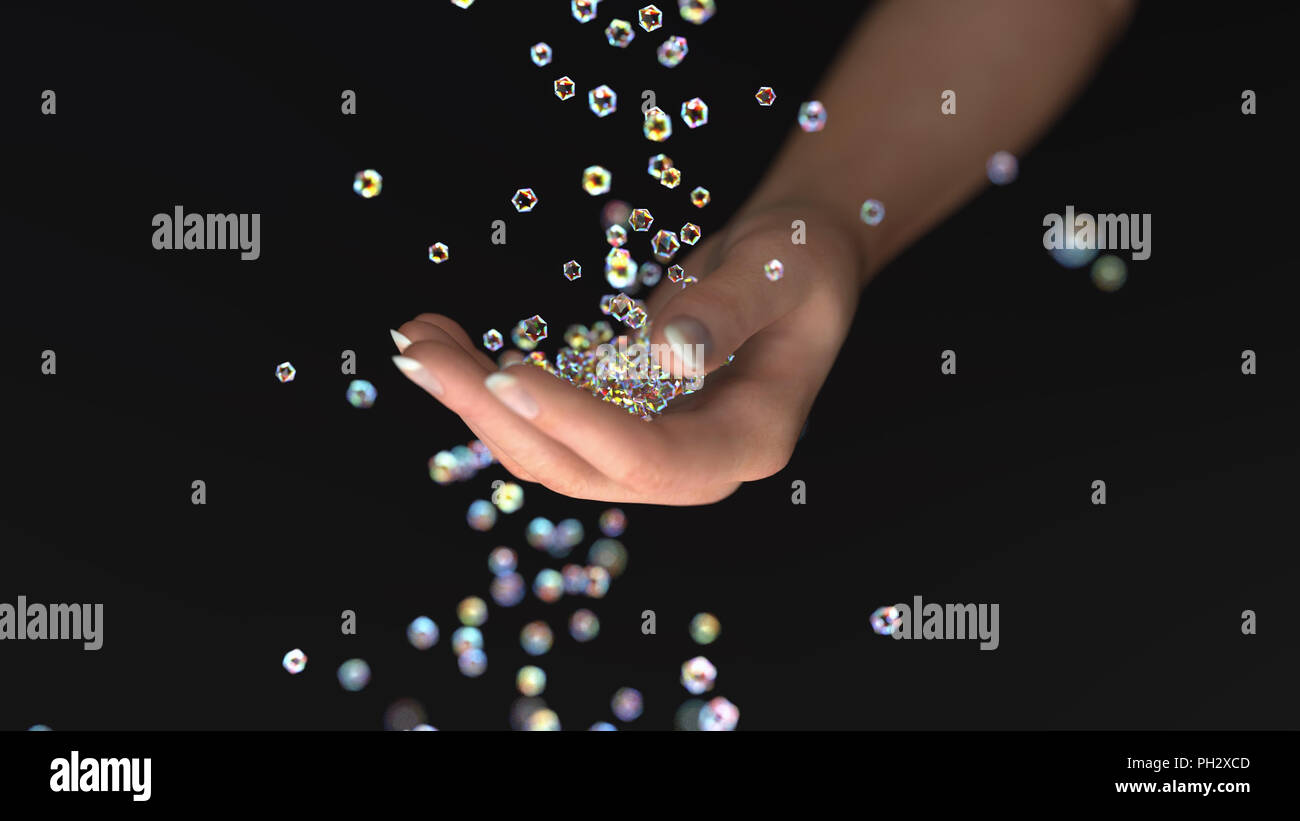 sparkling crystals fall into the hand Stock Photo - Alamy