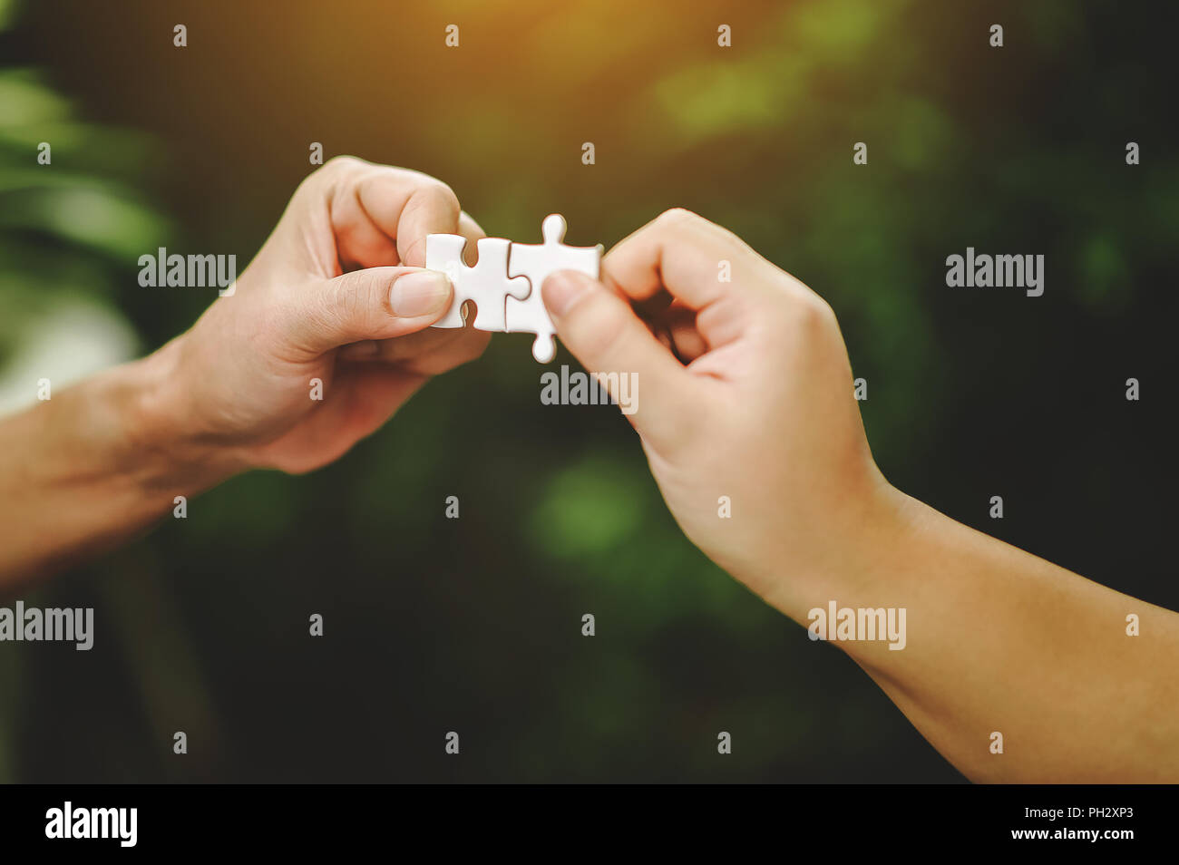 High view of businessmen solving jigsaw puzzle. Unity in the group Team ...