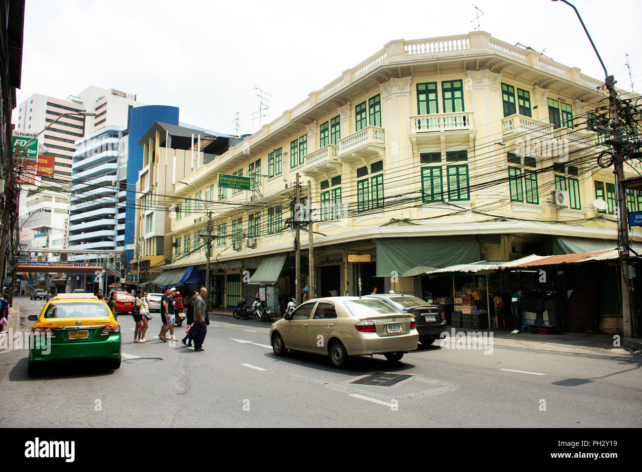 Thai people drive car and ride motorcycle on Chak Phet road with ...