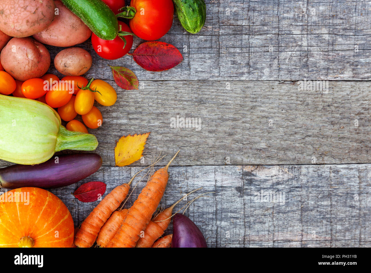 Assortment different fresh organic vegetables on country style wooden ...