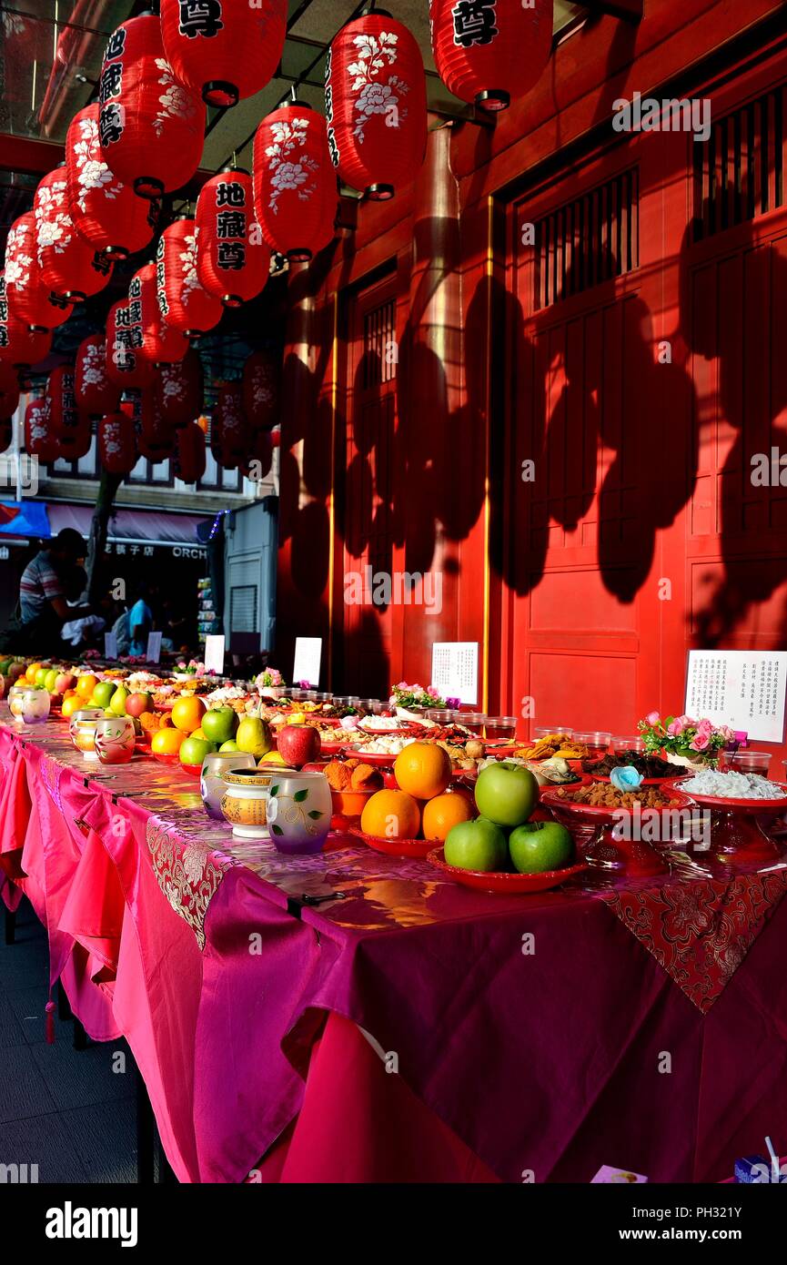 Tables with offerings and red Chinese hanging lanterns to celebrate ...
