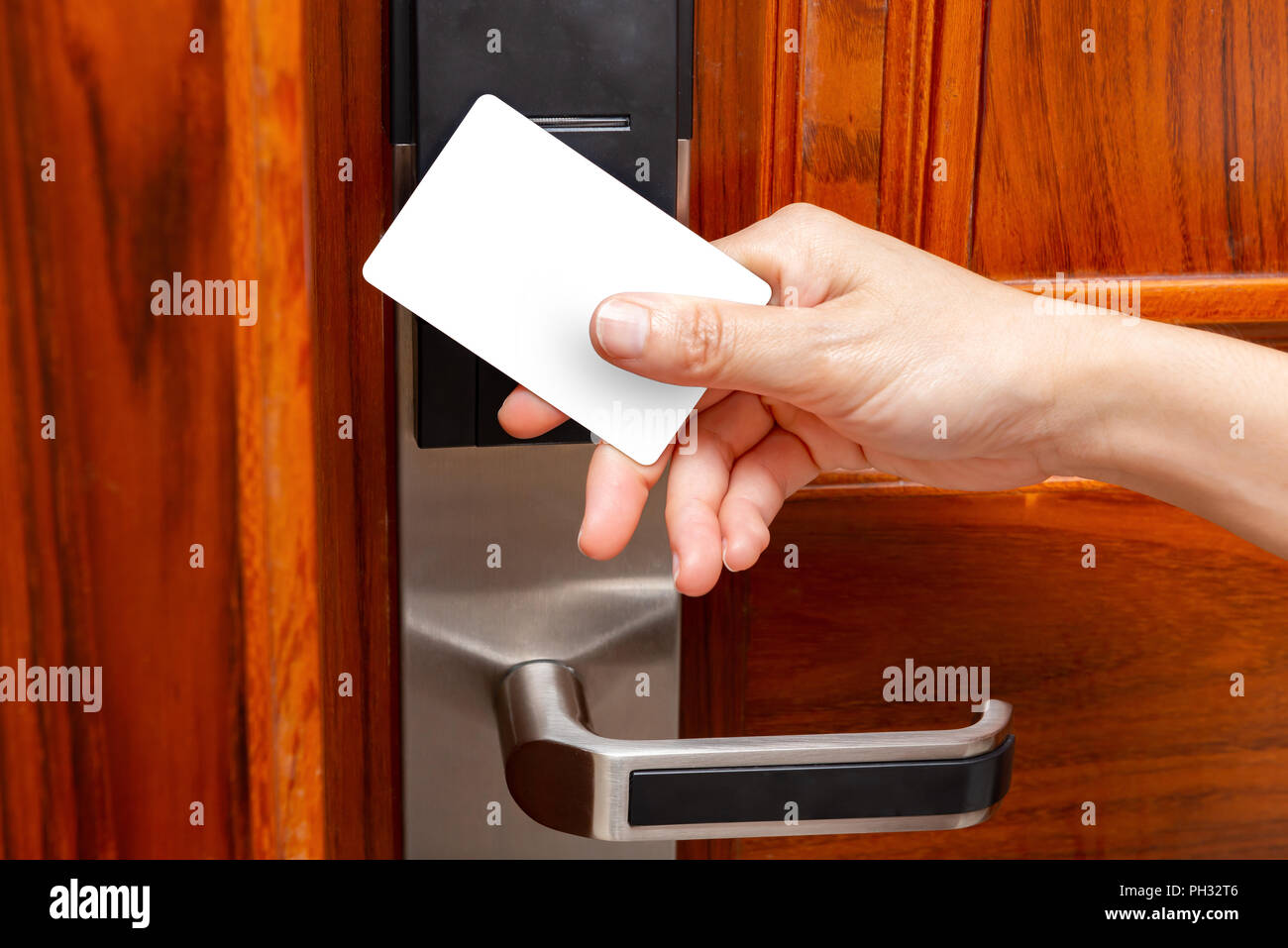 lady opening an electronic door lock by a blank security card Stock ...