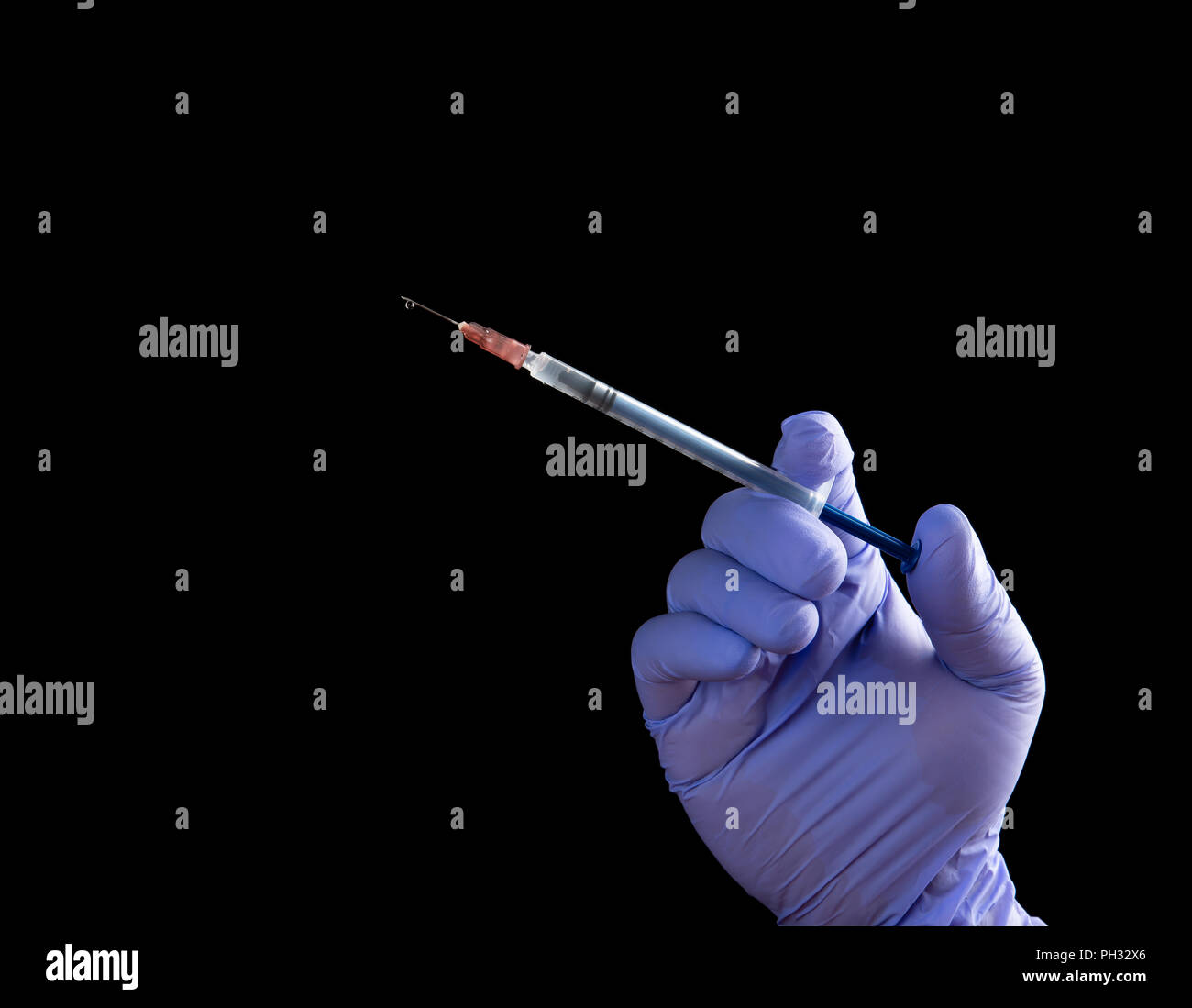 hand holding syringe medical injection on black background Stock Photo ...