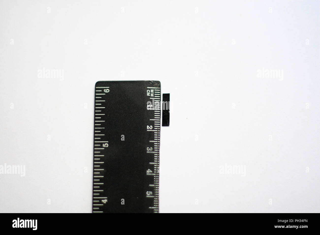 Measuring a black material Stock Photo - Alamy